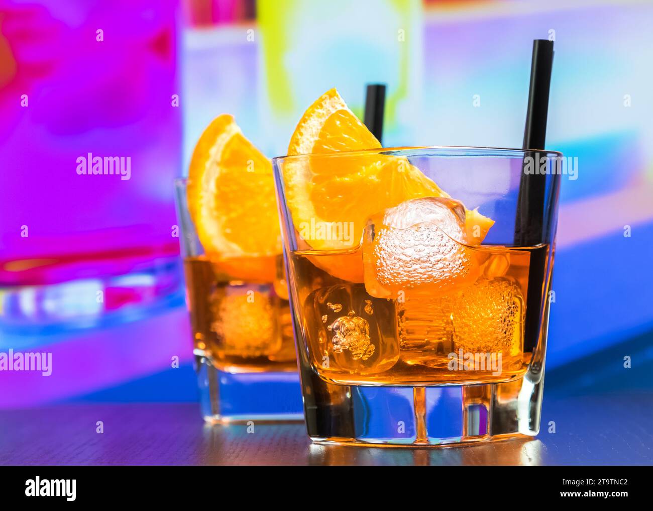 two glasses of spritz aperitif aperol cocktail with orange slices and ...