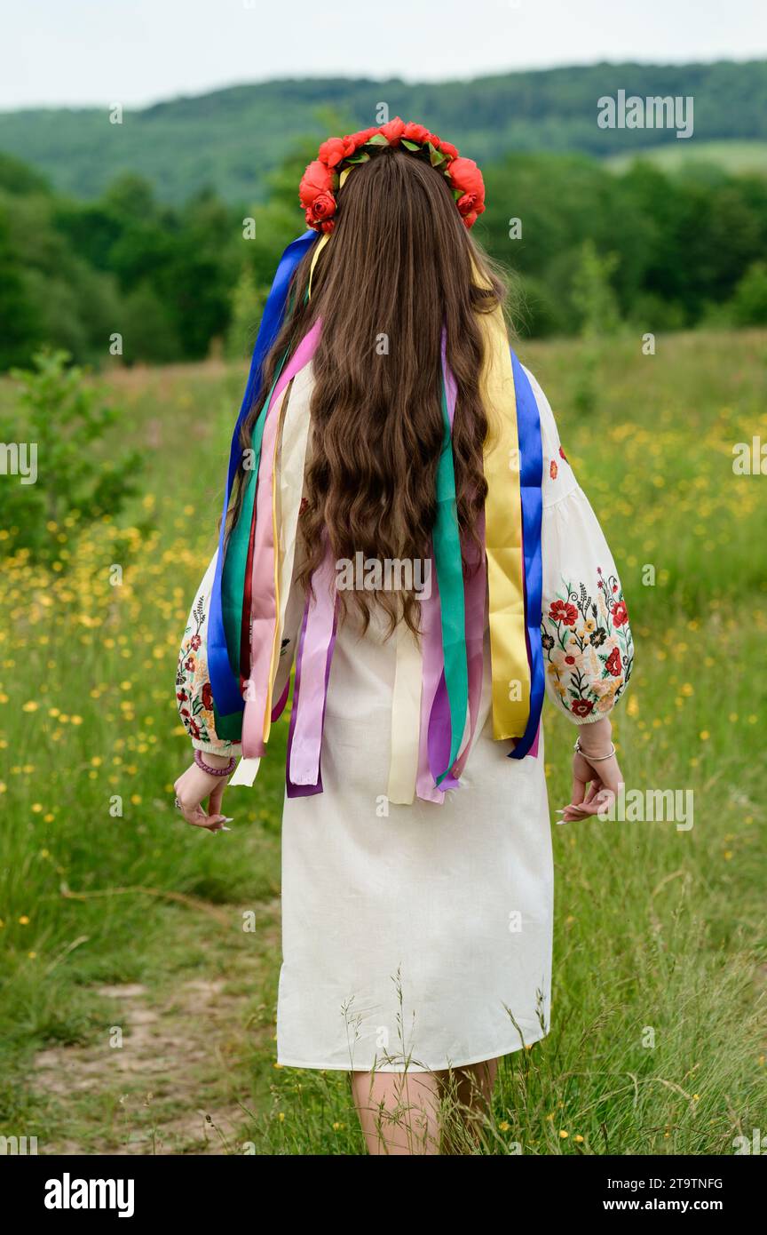 The girl, with her back turned and dressed in Ukrainian national ...