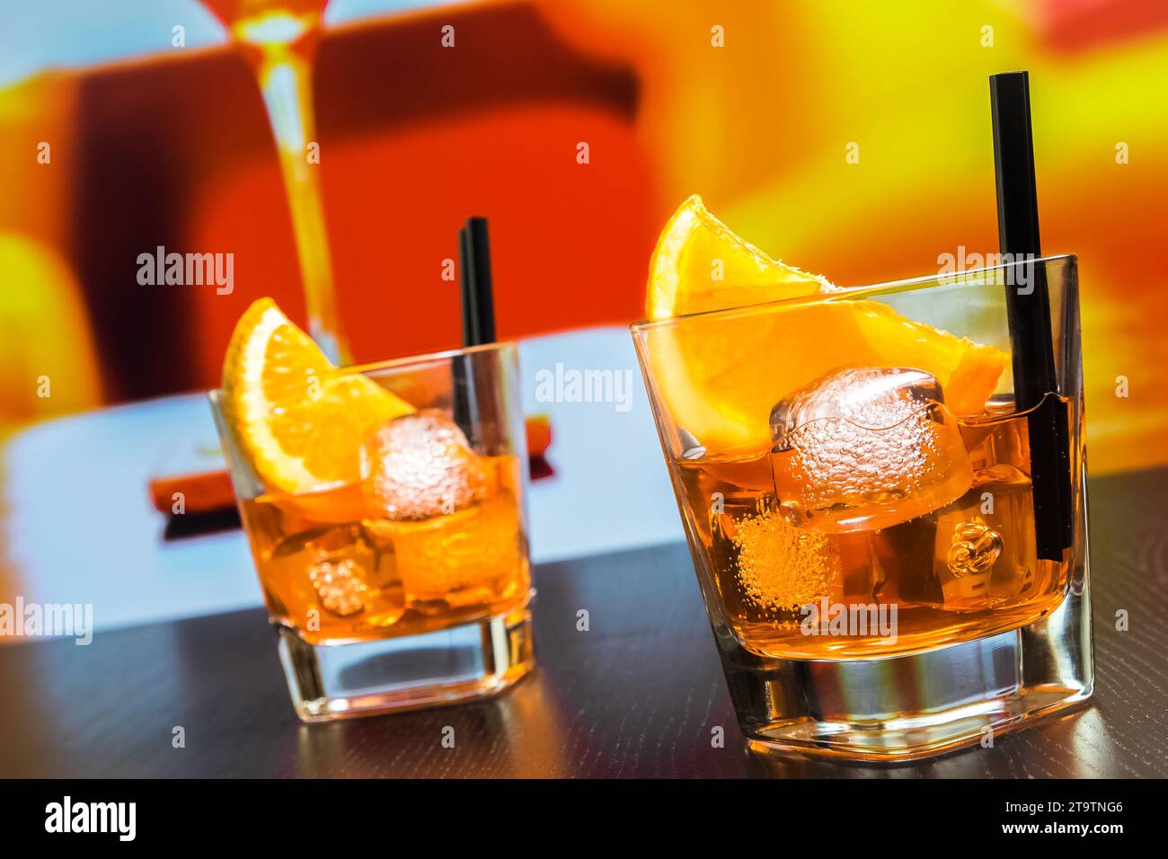 two glasses of spritz aperitif aperol cocktail with orange slices and ...