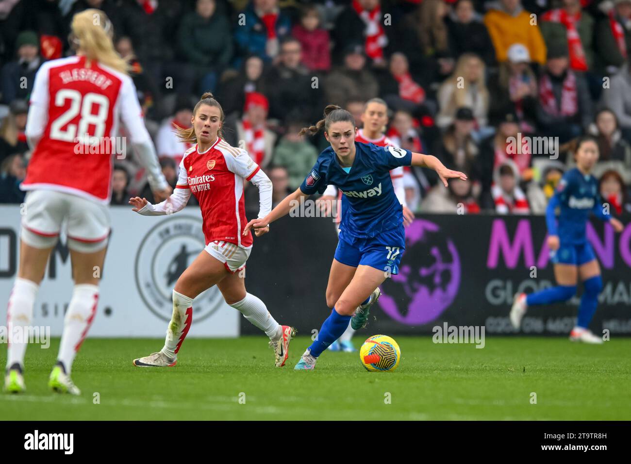 Emma Harries of West Ham Women drives forward with the ball during the ...