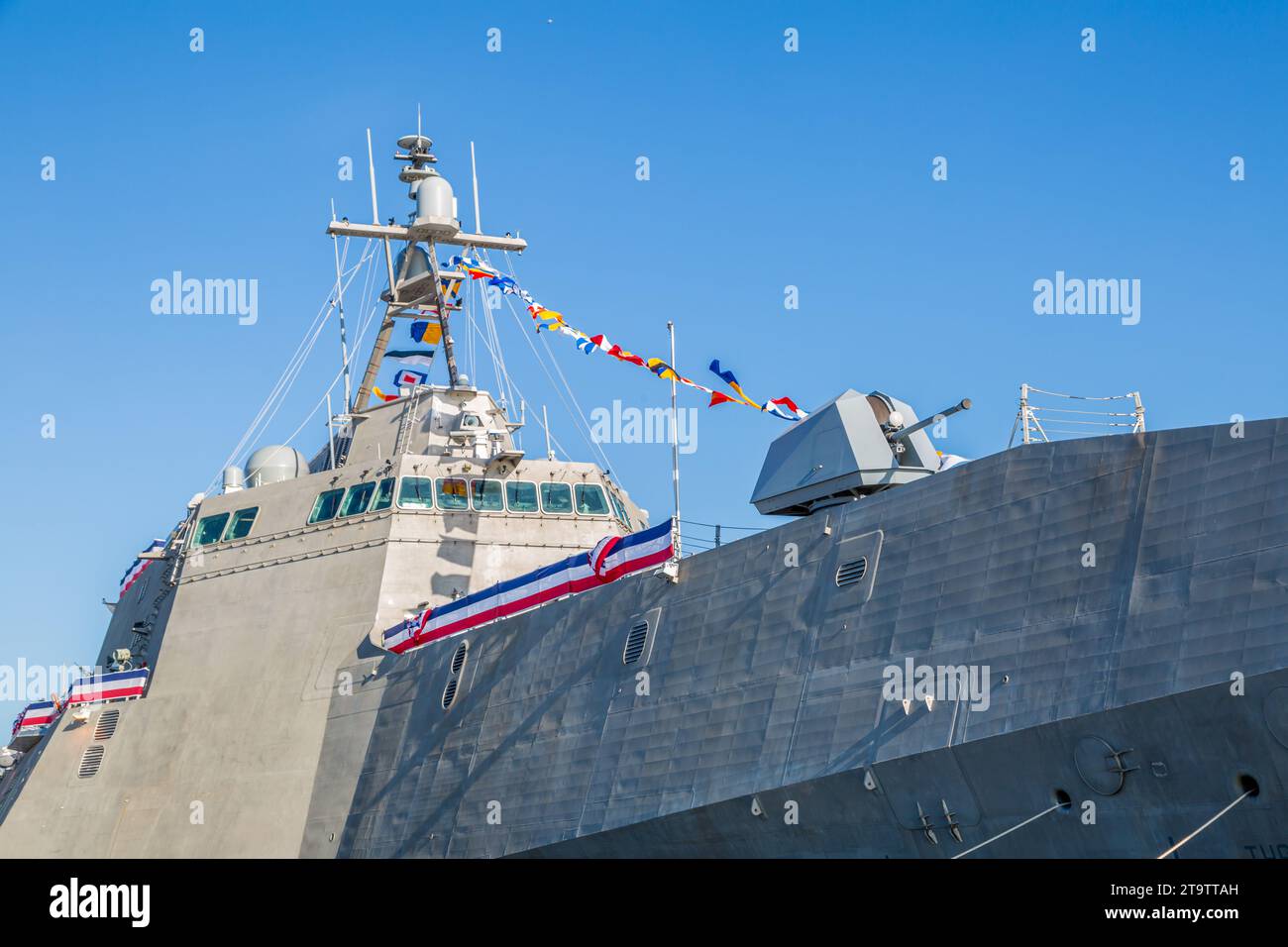 Flags fly from the bridge of the USS Jackson LCS-6 Independence class ...