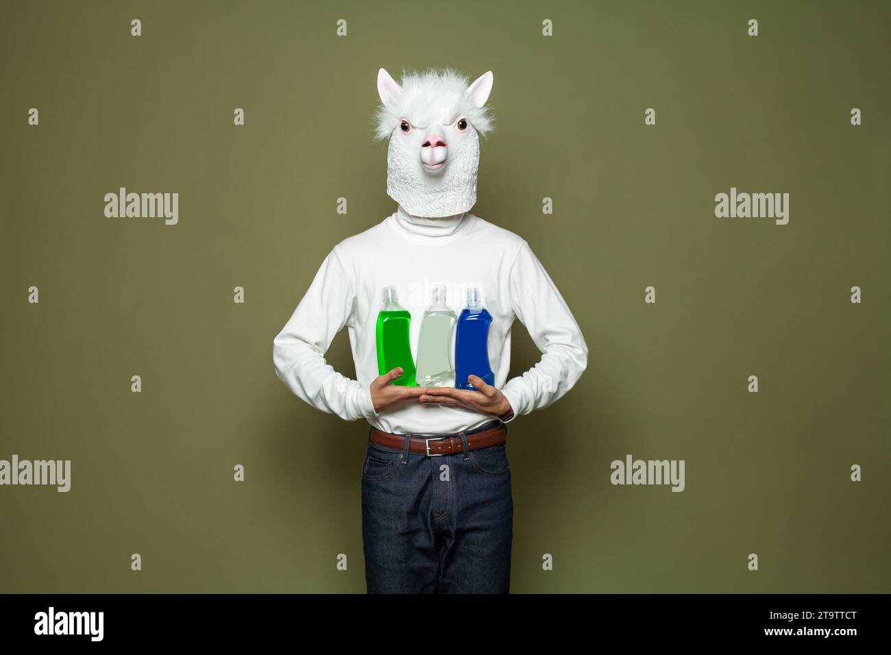 Lama man holding plastic bottles on green banner background Stock Photo ...