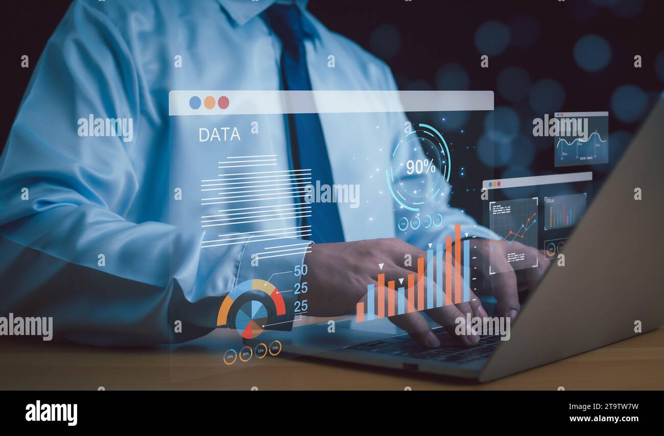 Businessman use computers to analyze business and manage corporate data ...