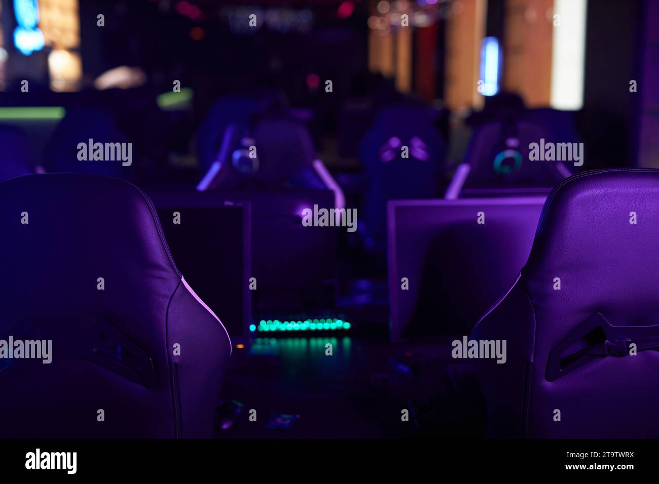Background image of gaming arena with chairs and computers in row, copy ...
