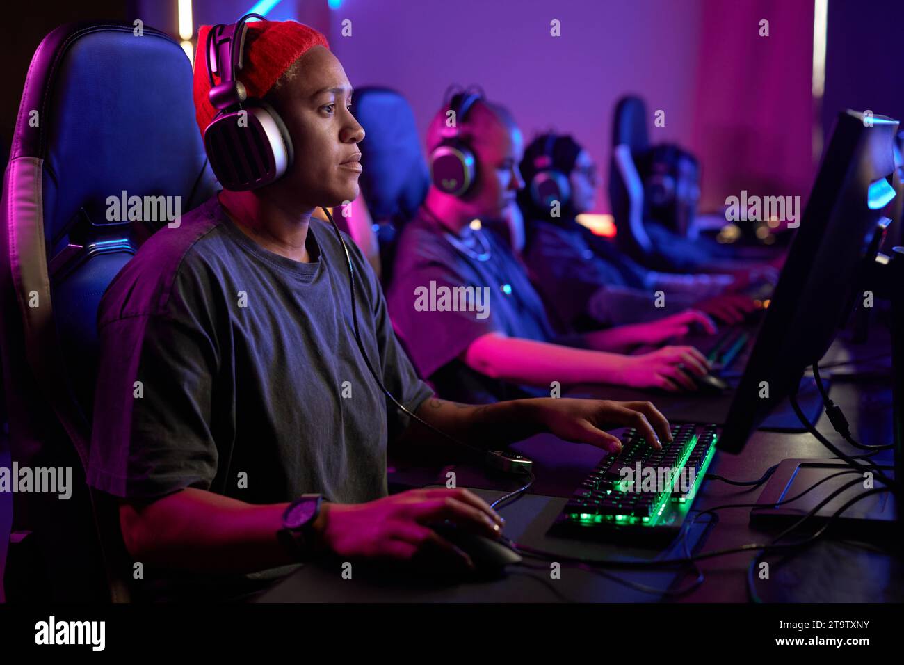 Side view portrait of Black woman playing video games professionally in ...