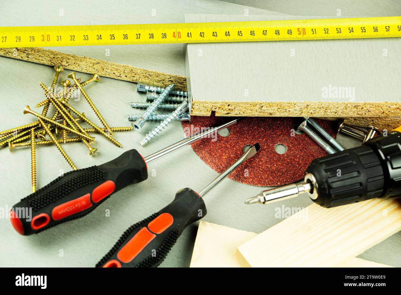 tools for repair and construction. Screwdriver, furniture screws ...