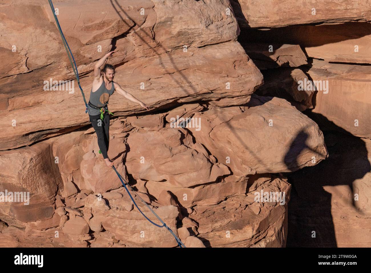 A man on the highline with his shadow on the canyon wall at the GGBY ...