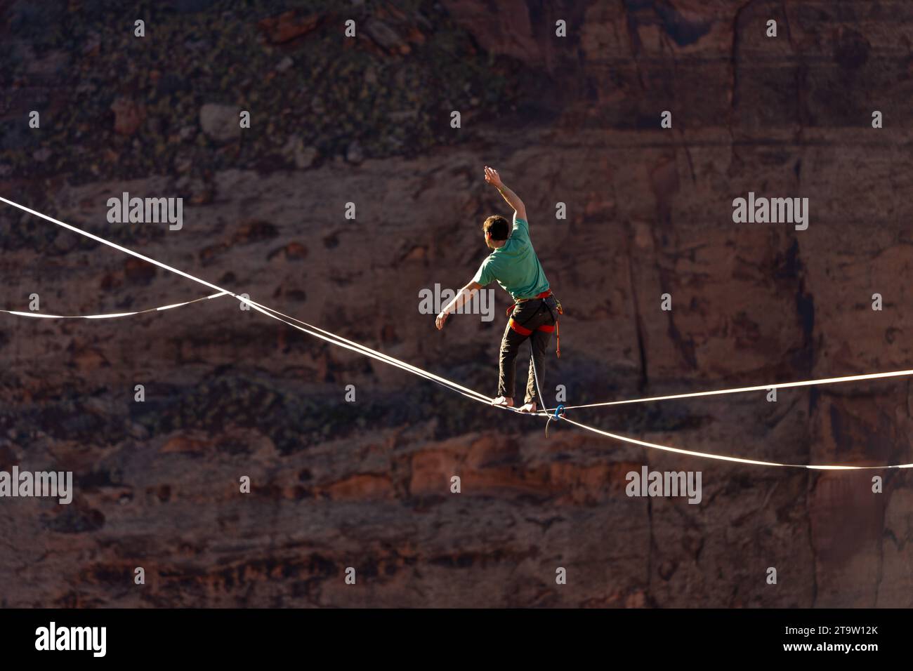 Telephoto view of a man walking a highline at the GGBY World Highline ...