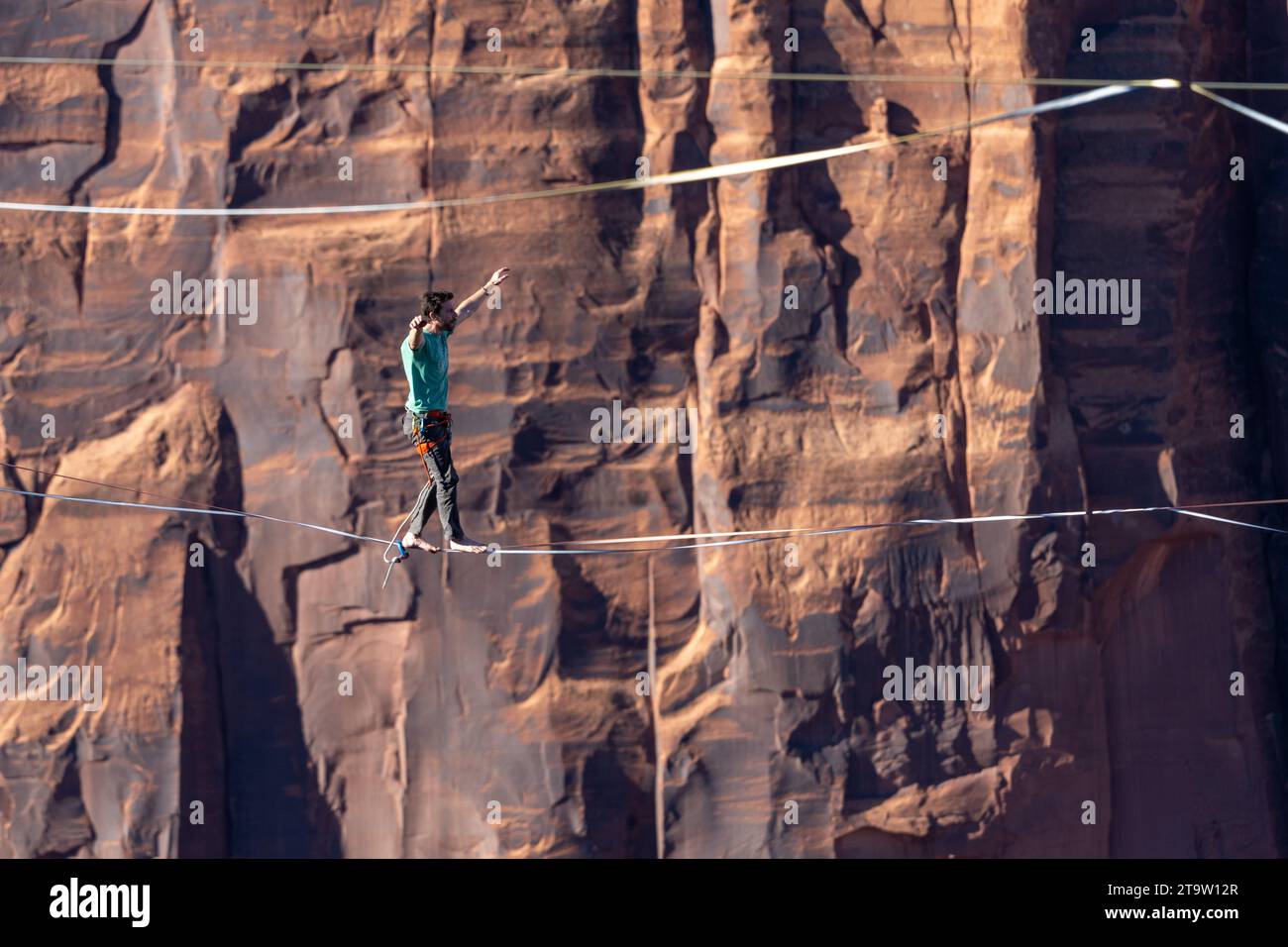 Telephoto view of a man walking a highline at the GGBY World Highline ...