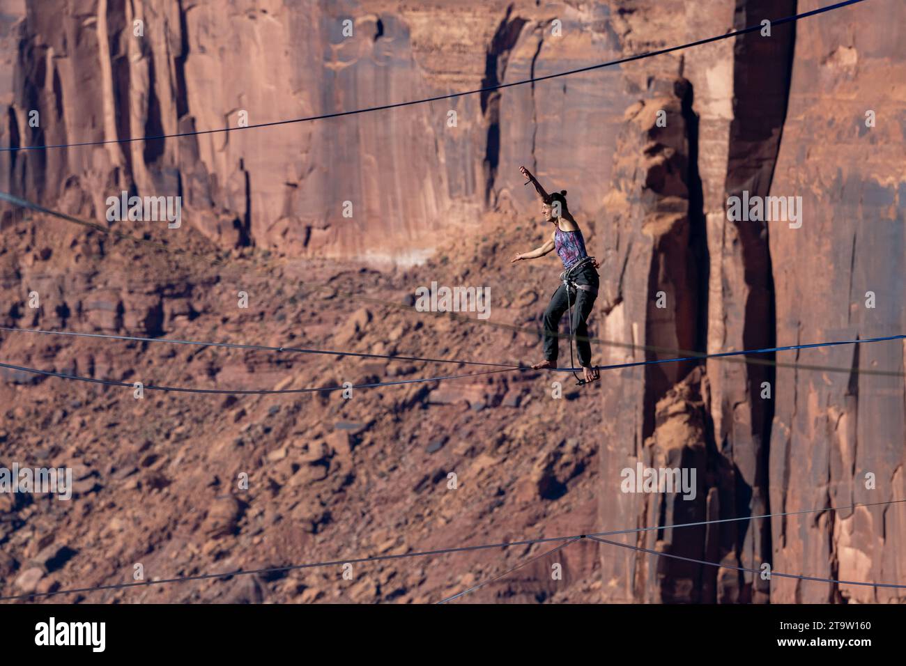 A woman walks the highline 500 feet above Mineral Canyon at the GGBY ...