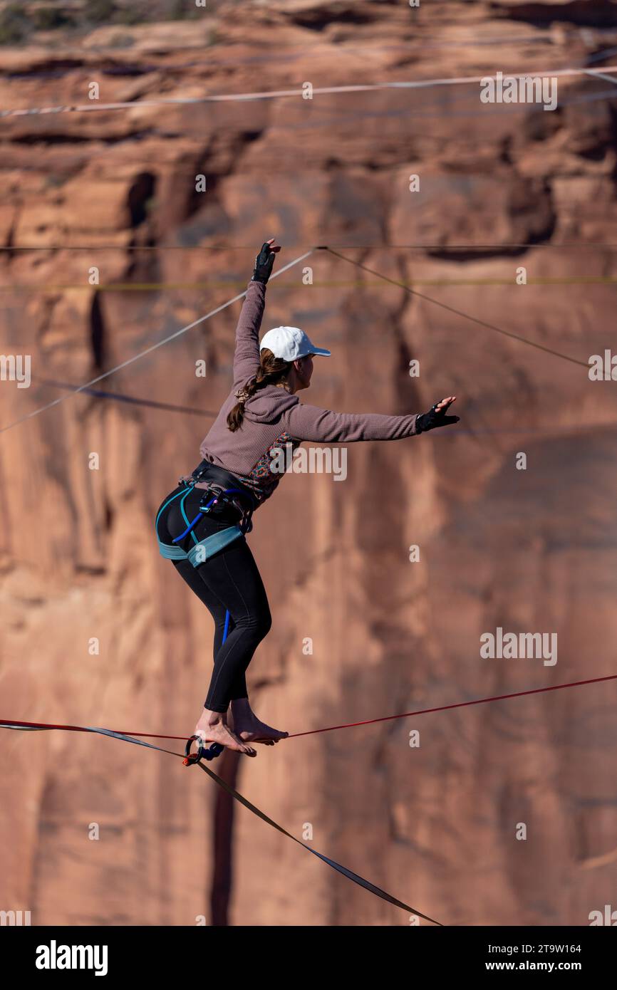 A young woman walking a highline at the GGBY World Highline Festival in ...