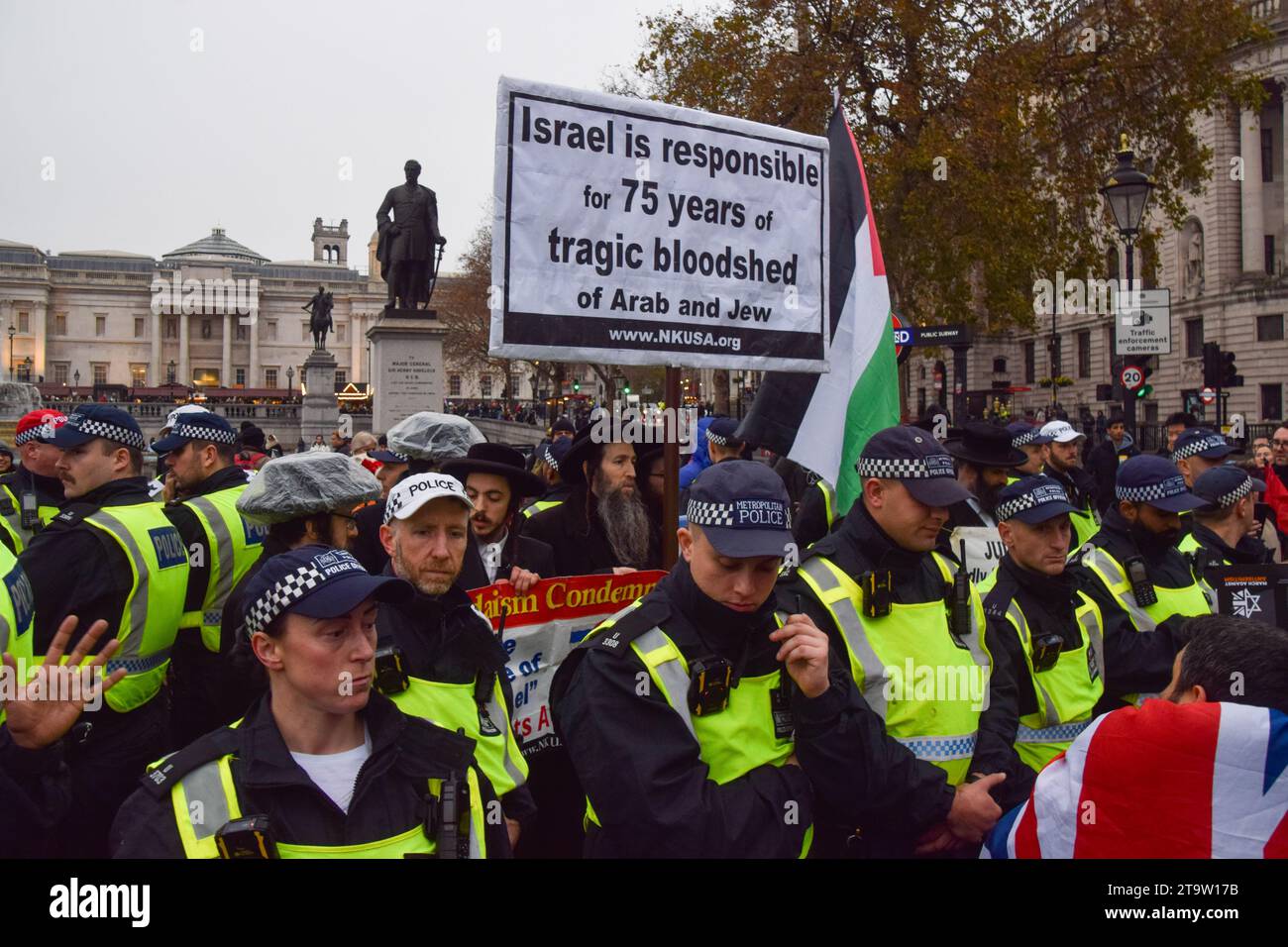 London, UK. 26th November 2023. Police officers intervene as anti ...