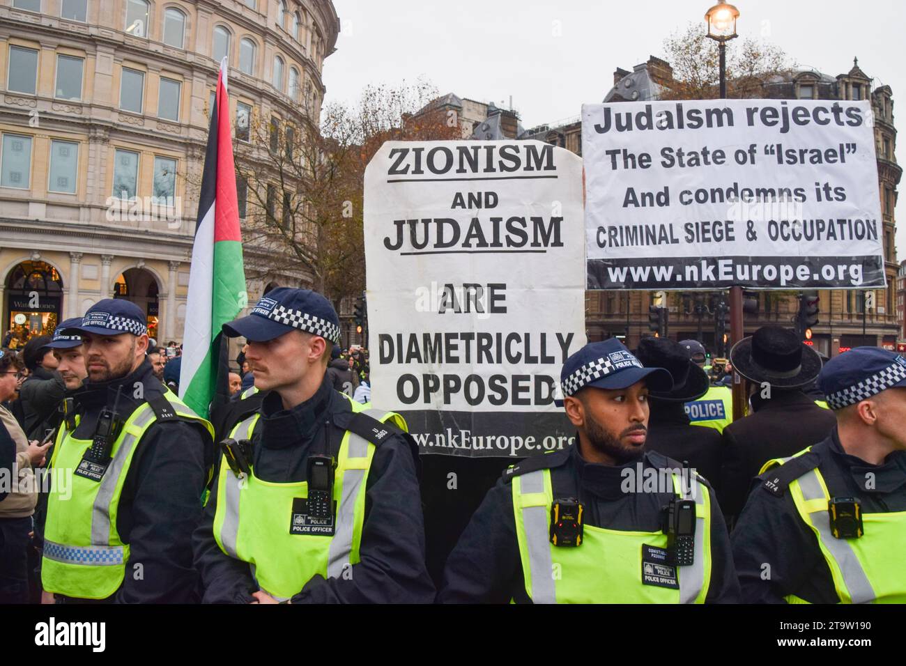 London, UK. 26th November 2023. Police officers intervene as anti ...
