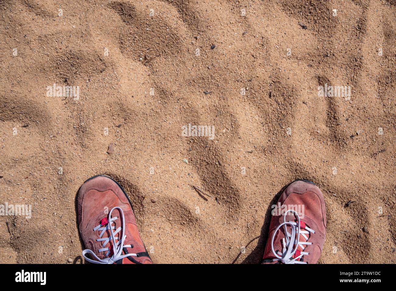 Two red shoes in the sand photographed from above Stock Photo - Alamy