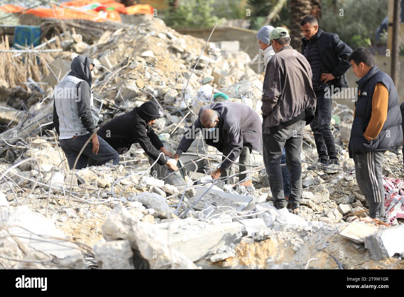 Civil defense team and civilians conduct a search and rescue operation ...