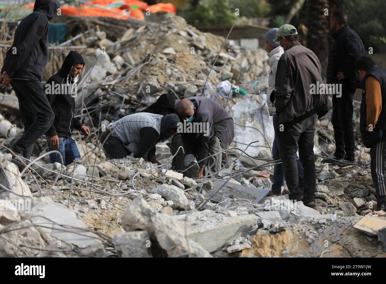 Civil defense team and civilians conduct a search and rescue operation ...