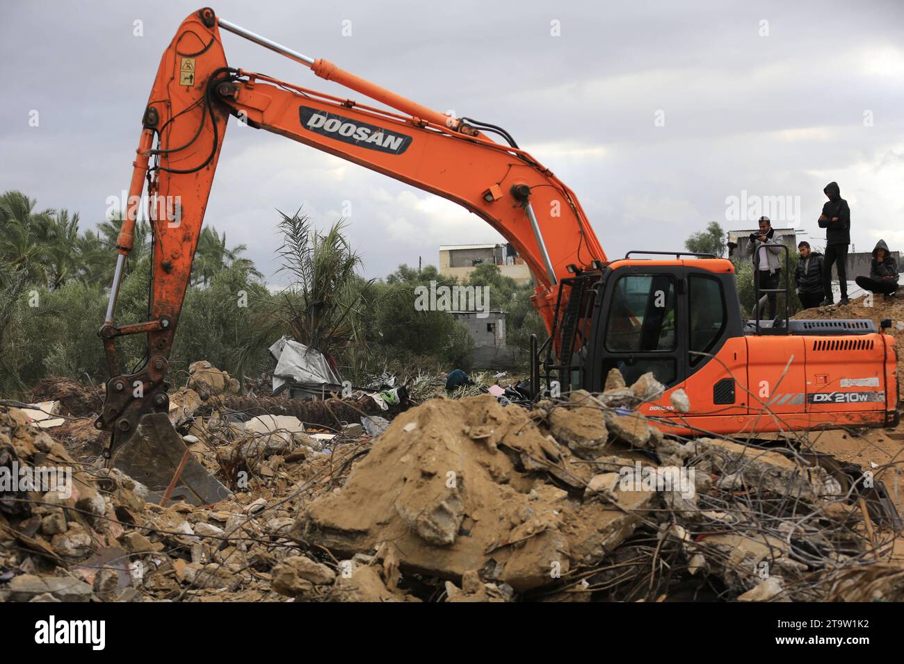 Civil defense team and civilians conduct a search and rescue operation ...