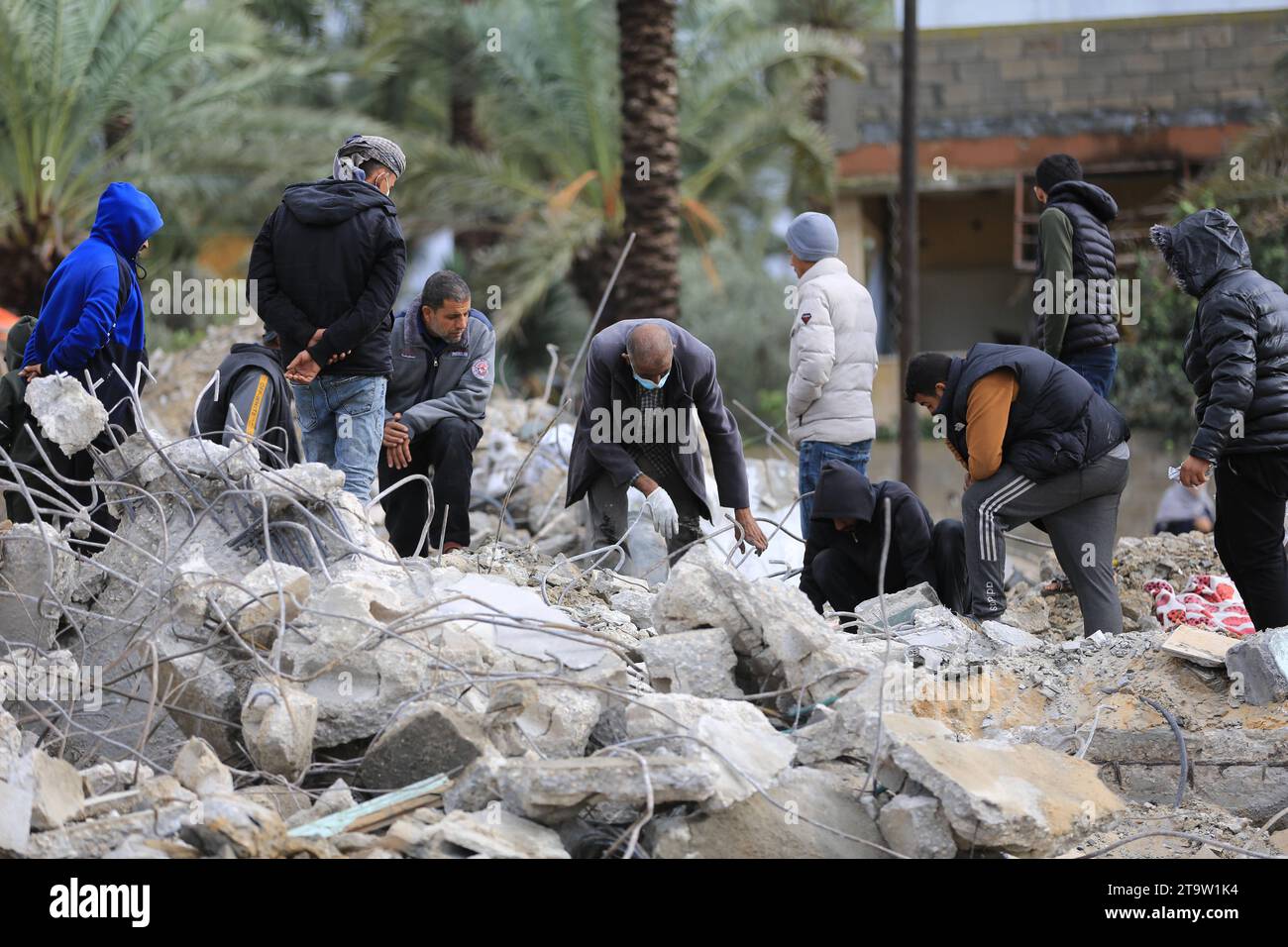 Civil defense team and civilians conduct a search and rescue operation ...
