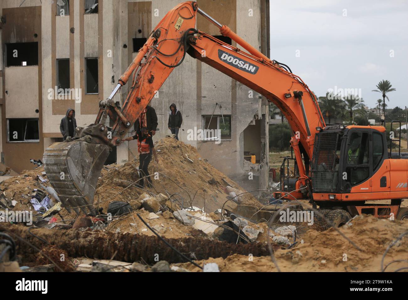 Civil defense team and civilians conduct a search and rescue operation ...