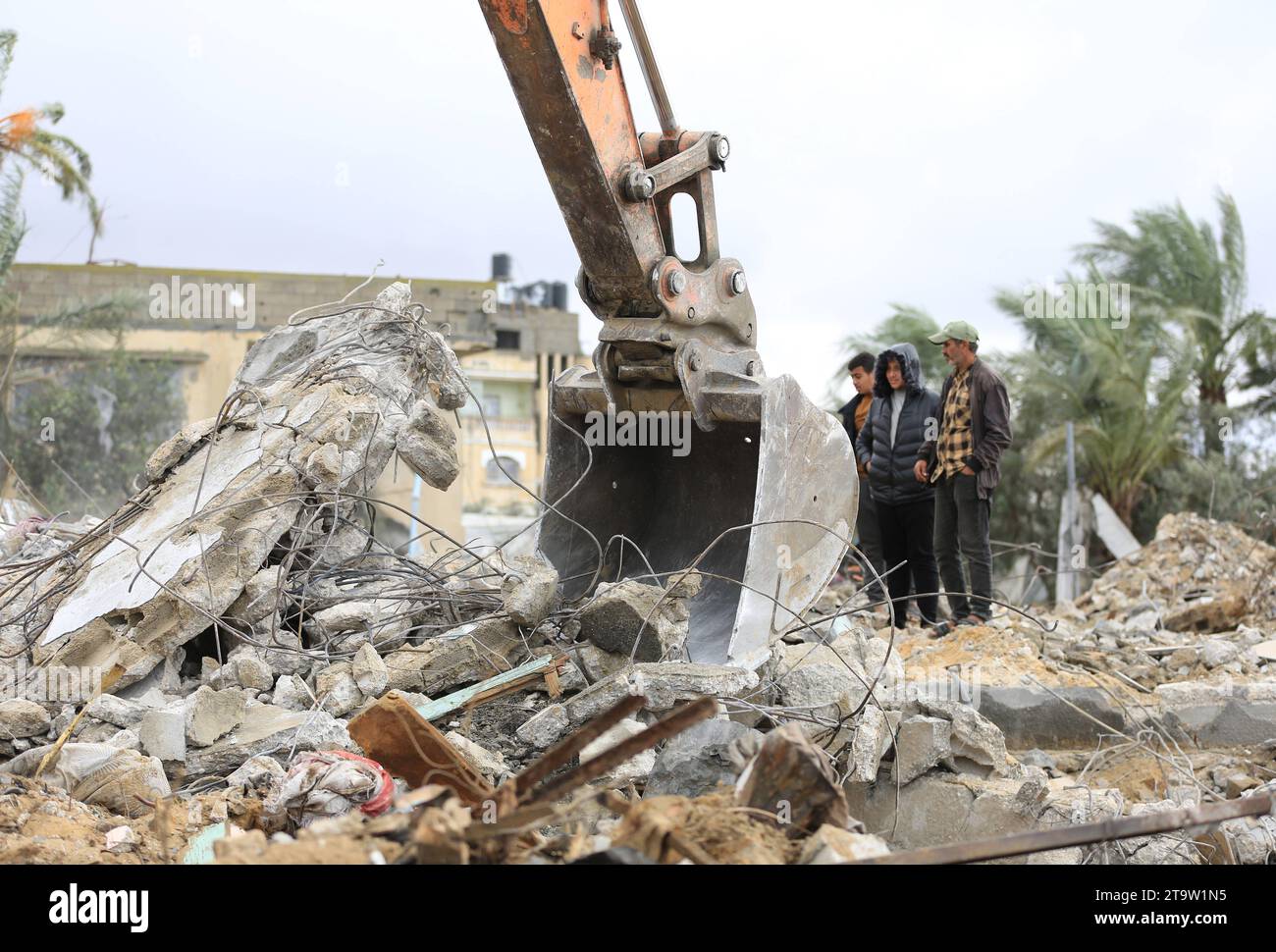 Civil defense team and civilians conduct a search and rescue operation ...