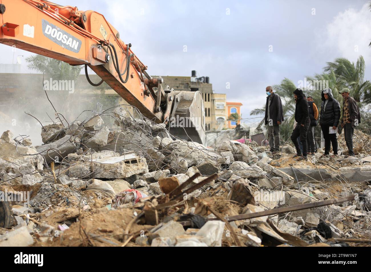 Civil defense team and civilians conduct a search and rescue operation ...