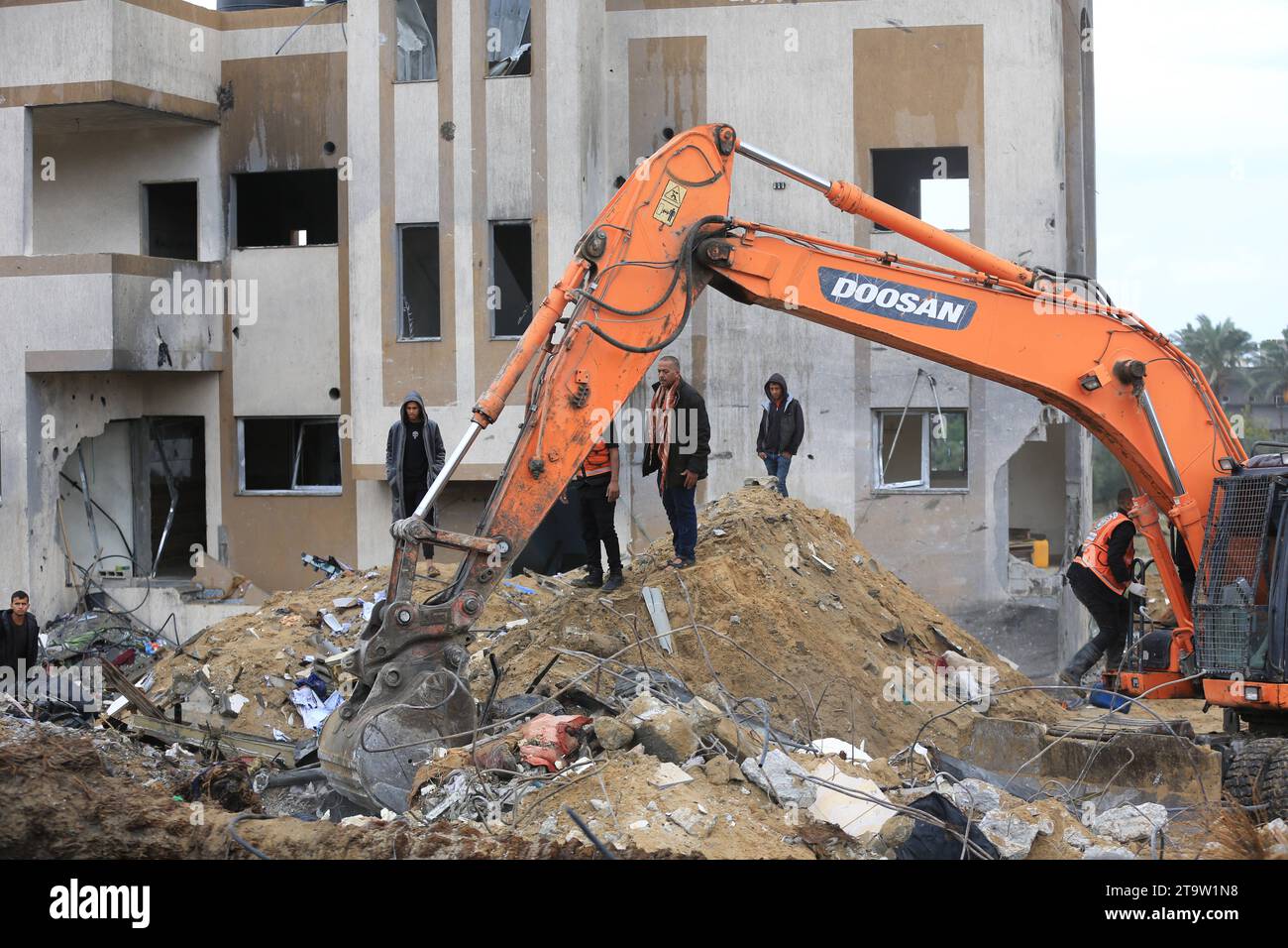 Civil defense team and civilians conduct a search and rescue operation ...