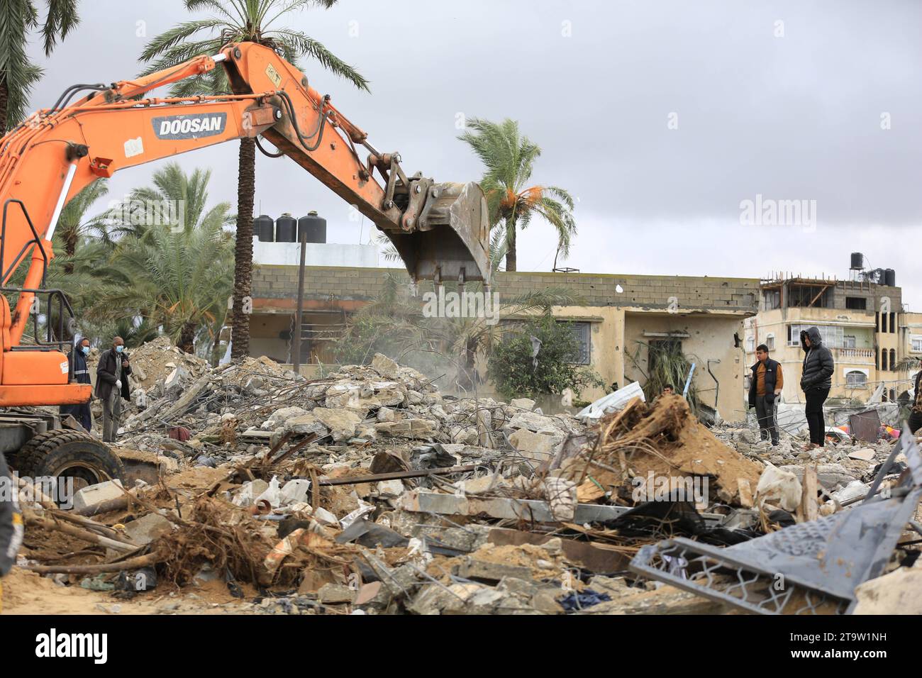 Civil defense team and civilians conduct a search and rescue operation ...