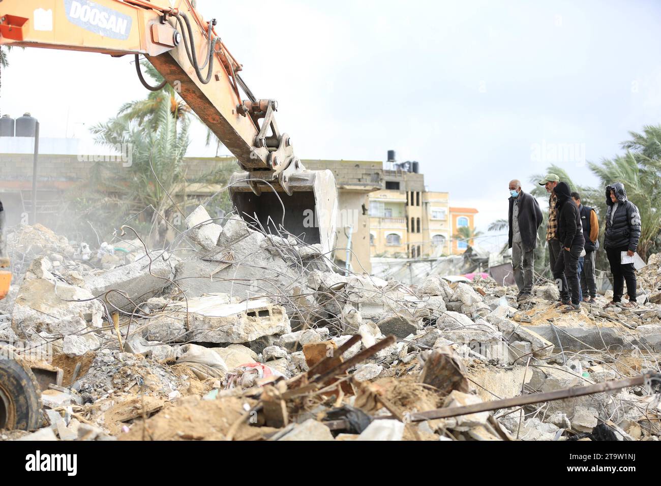 Civil defense team and civilians conduct a search and rescue operation ...