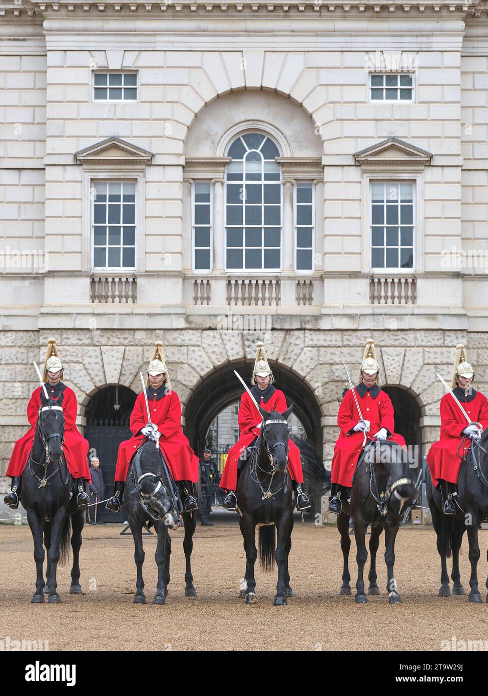 Five red coated Lifeguard mounted soldiers with swords line up on Horse ...