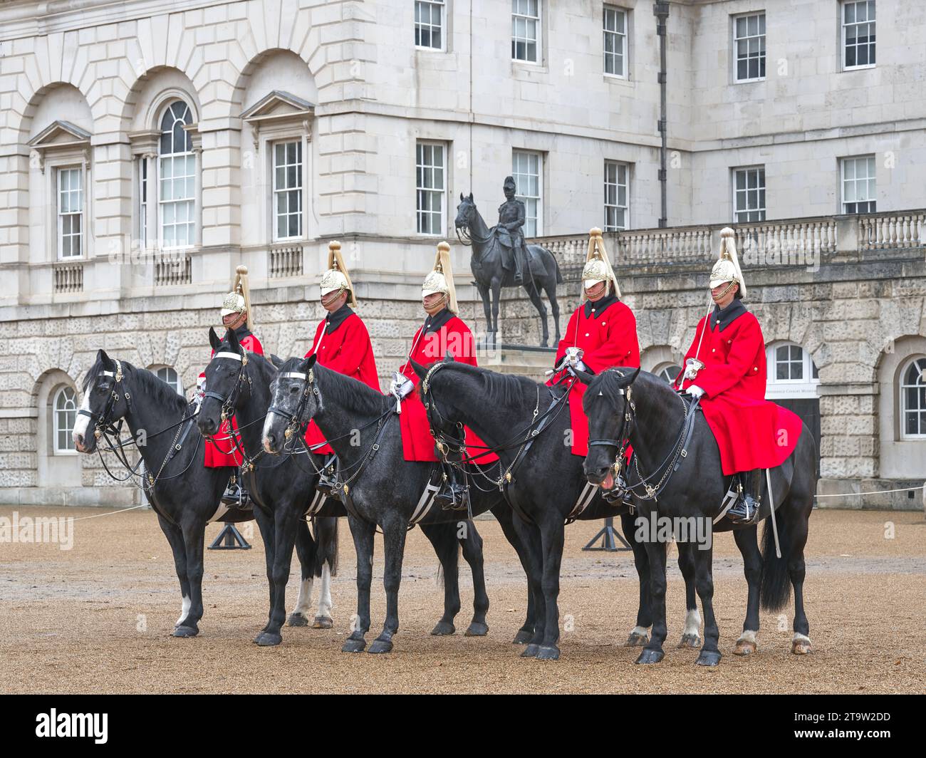 Five red coated Lifeguard mounted soldiers line up on Horse Guards ...