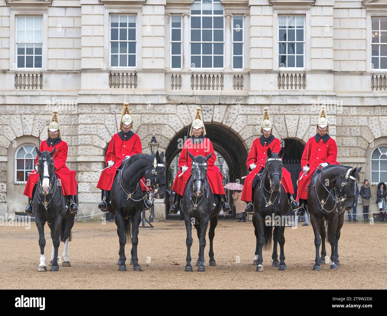 Five red coated Lifeguard mounted soldiers line up on Horse Guards ...