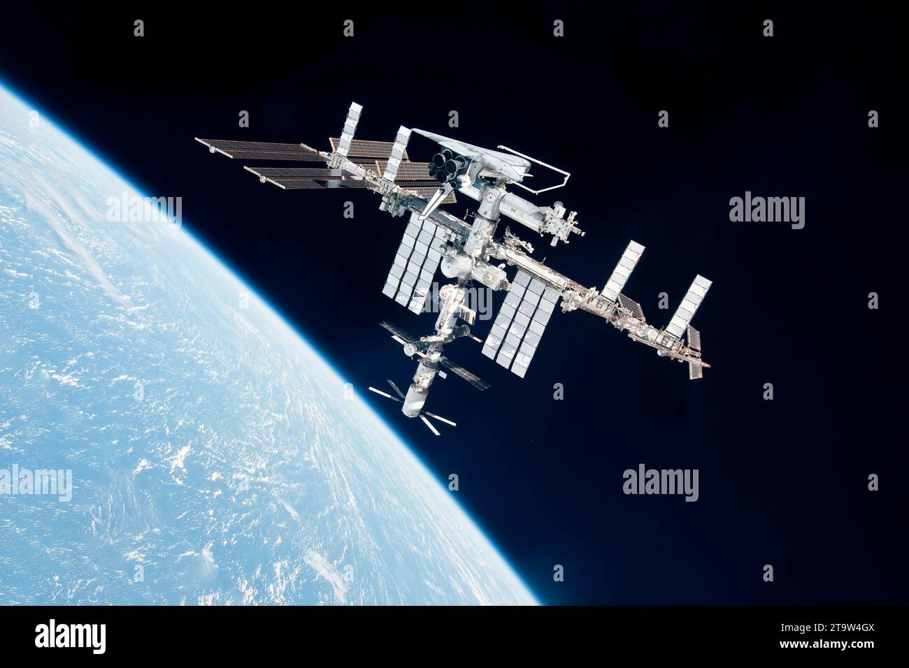 ISS above the surface of planet earth. Elements of this image furnished ...