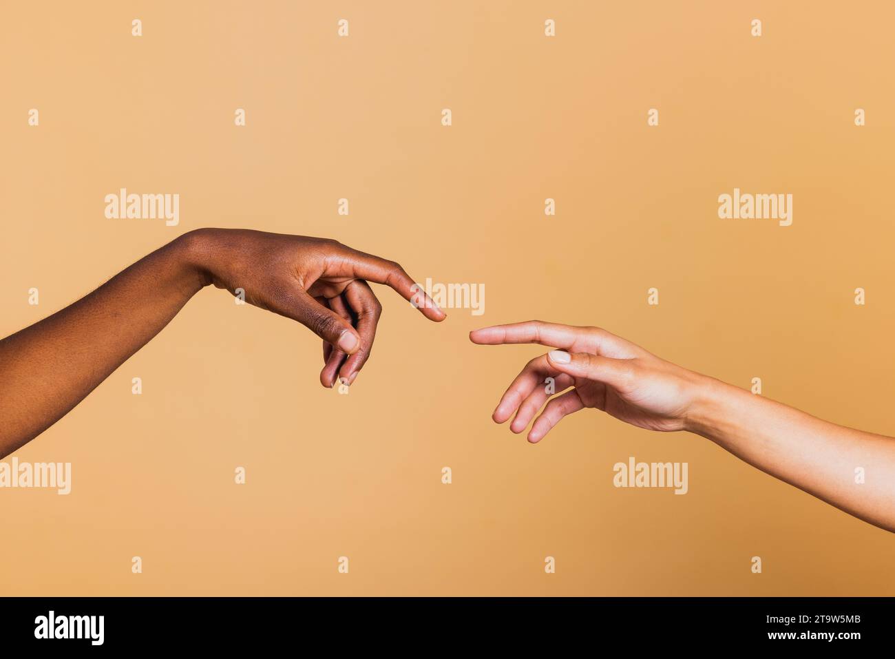 Close up of two female hands together on brown background. Hands of two ...