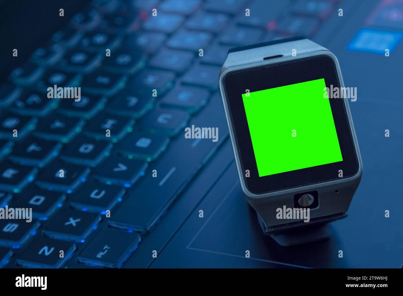 smartwatch near computer pc keyboard with chroma key green screen, new ...