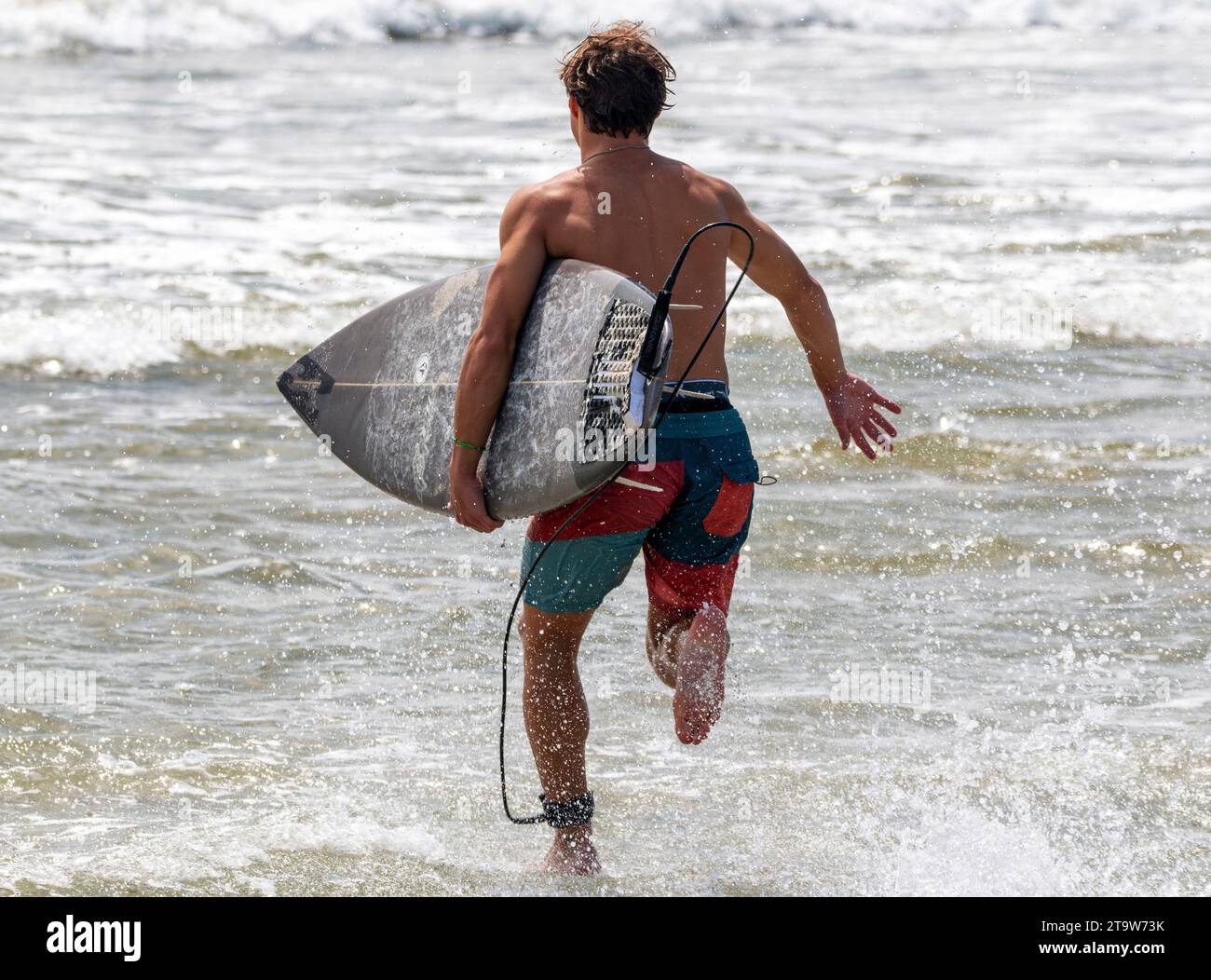 Man running from water hi-res stock photography and images - Alamy
