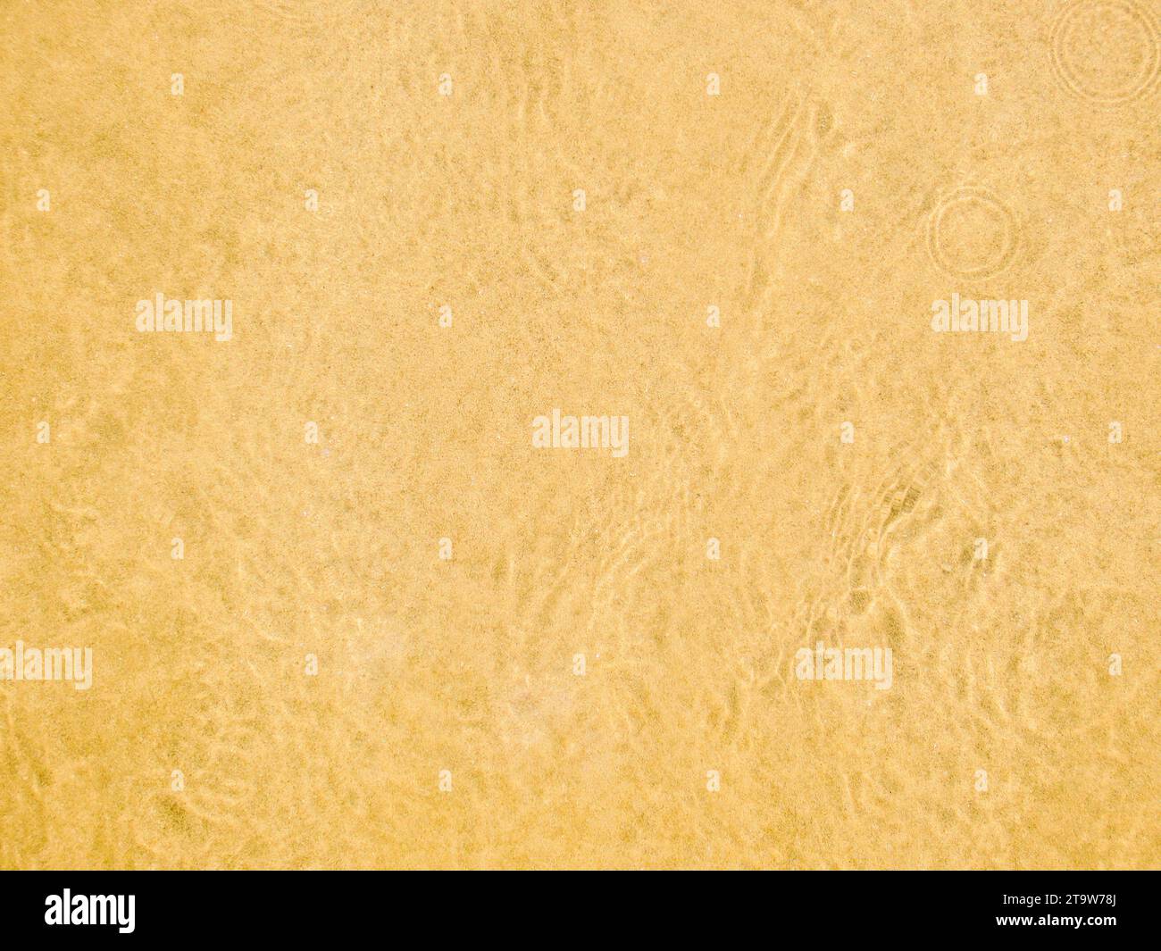 golden sand with water beach Stock Photo - Alamy