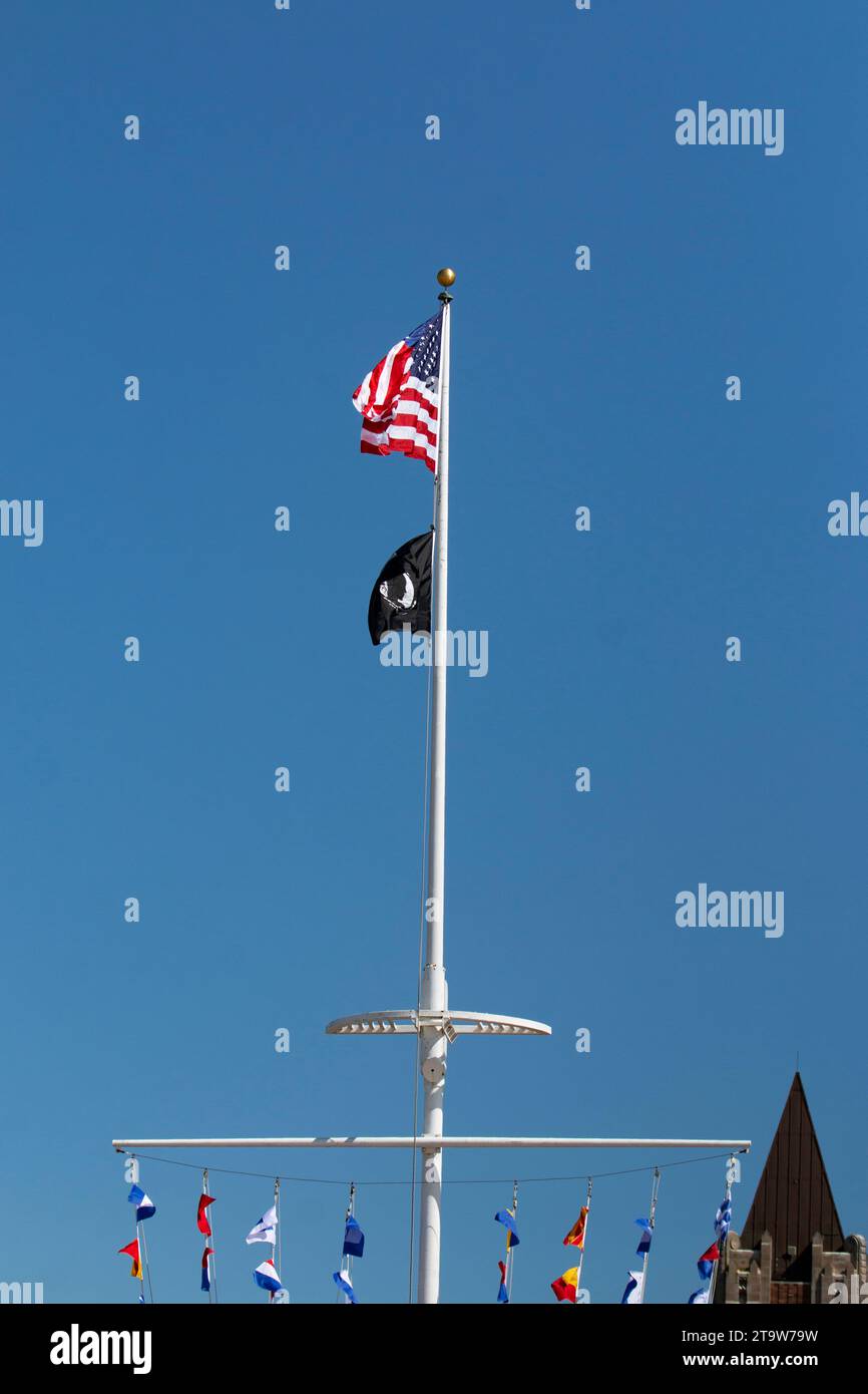 A tall flag pole with a flag on top of it Stock Photo - Alamy