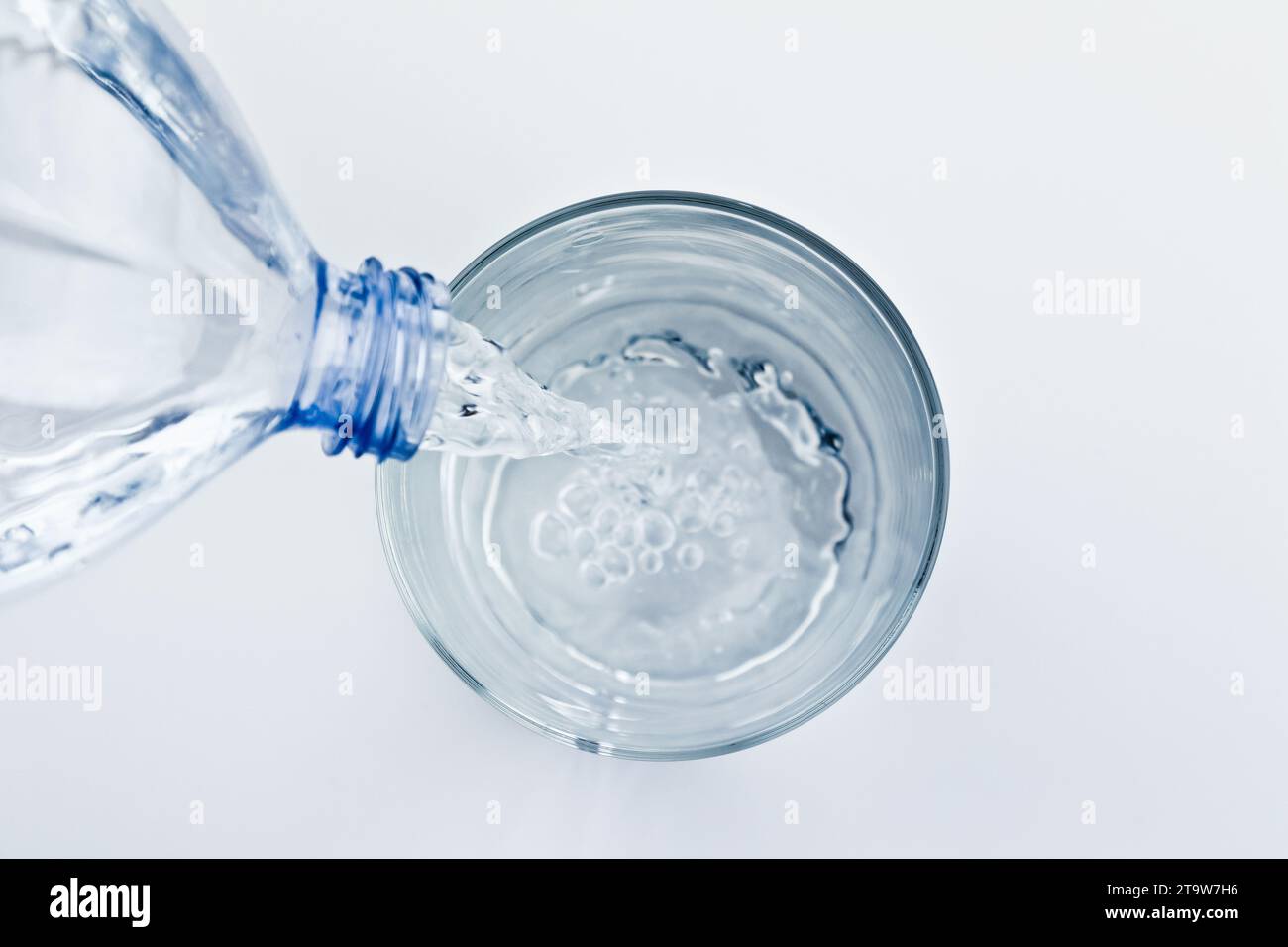 Filling glass water through bottle hi-res stock photography and images ...