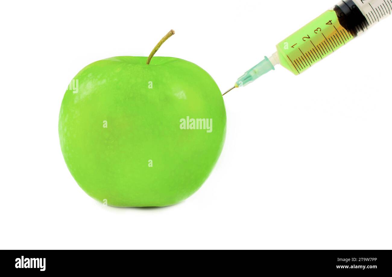 medical injection with liquid and a green apple, nutrition and health ...