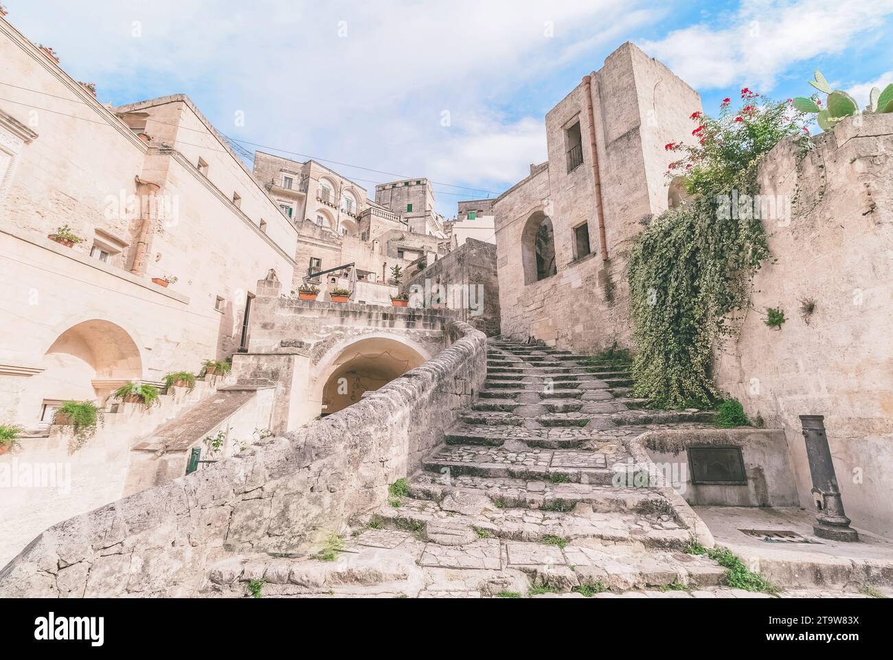 typical old stairs view of Matera under blue sky . Matera in Italy ...
