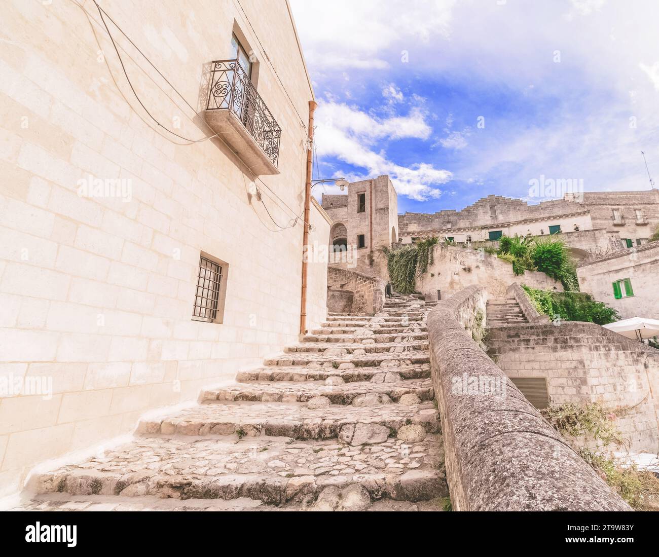 typical old stairs view of Matera under blue sky . Matera in Italy ...