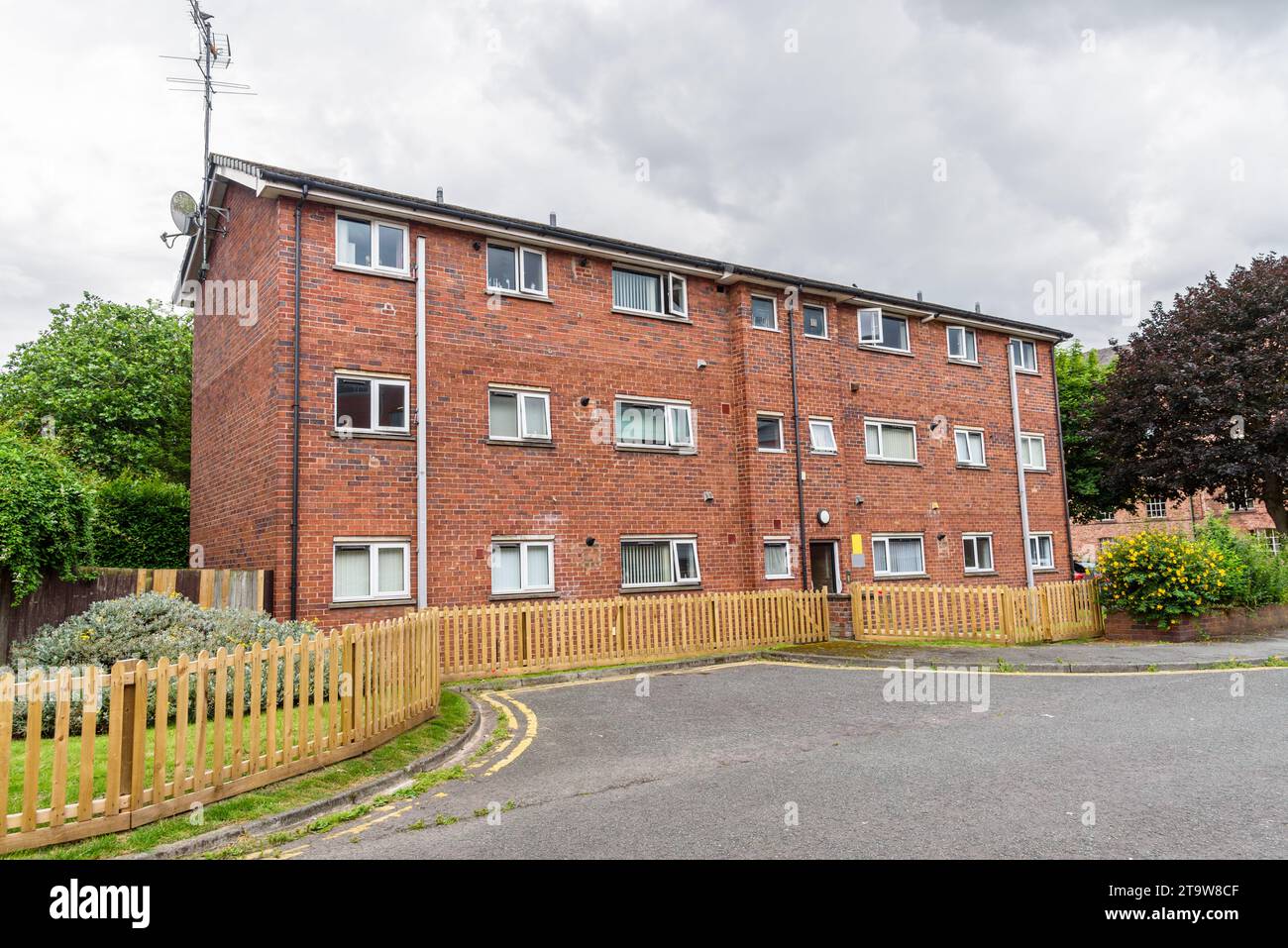 Renovated old tenement building under overcast sky Stock Photo - Alamy