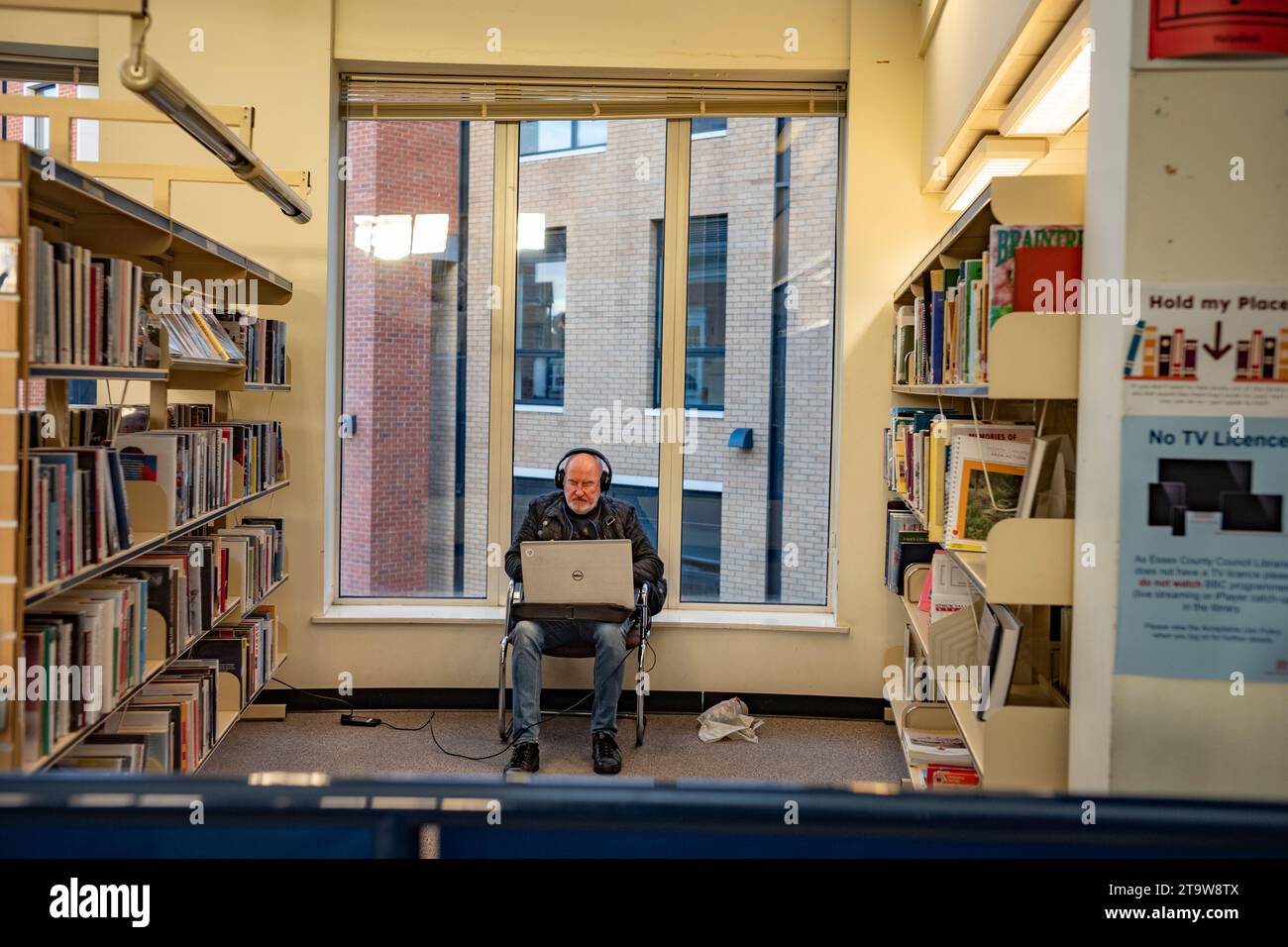 Braintree Essex England. Nov 2023 Man alone in Braintree Library with ...