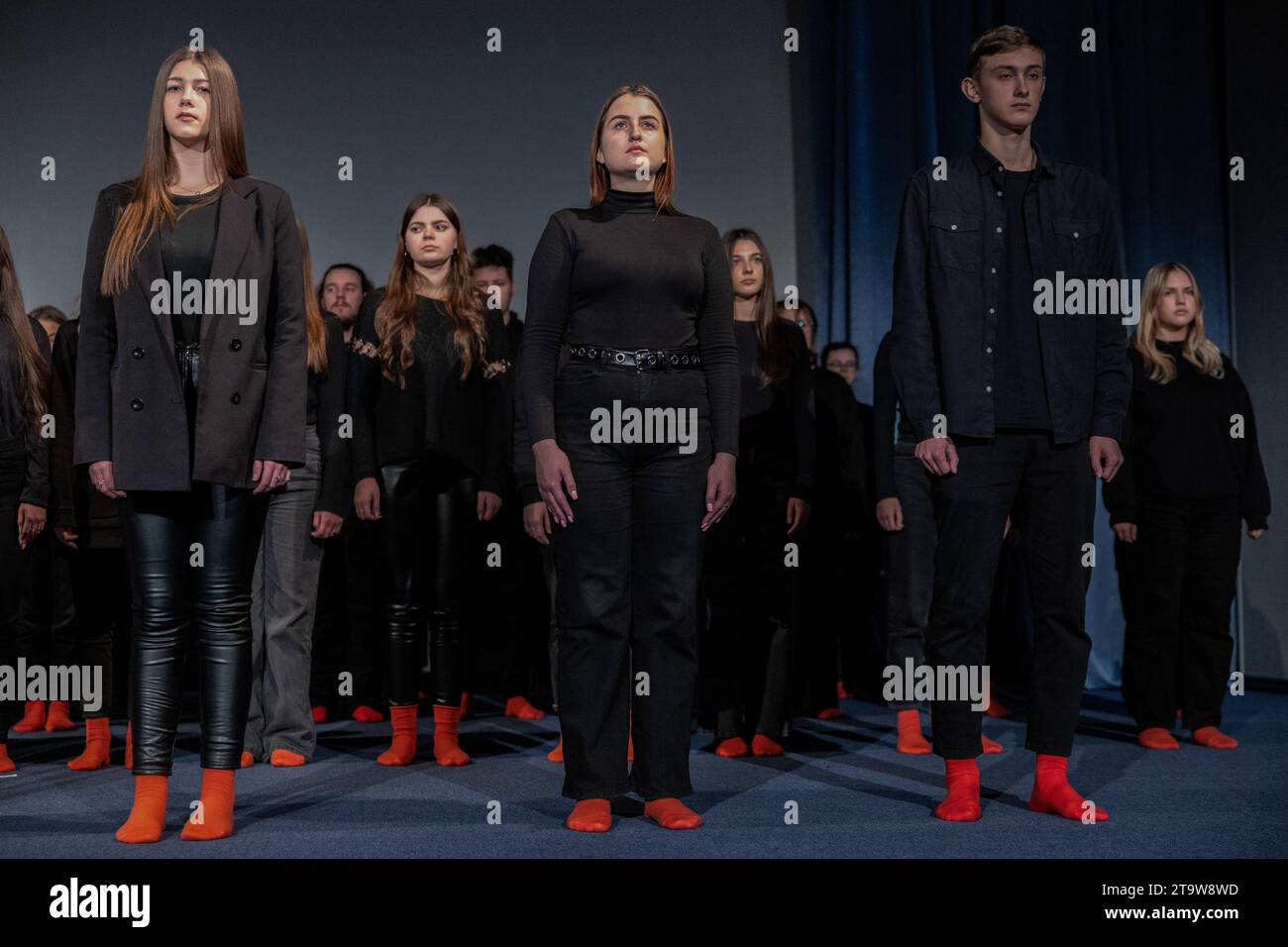 Young people play victims of violence in a performance dedicated to ...