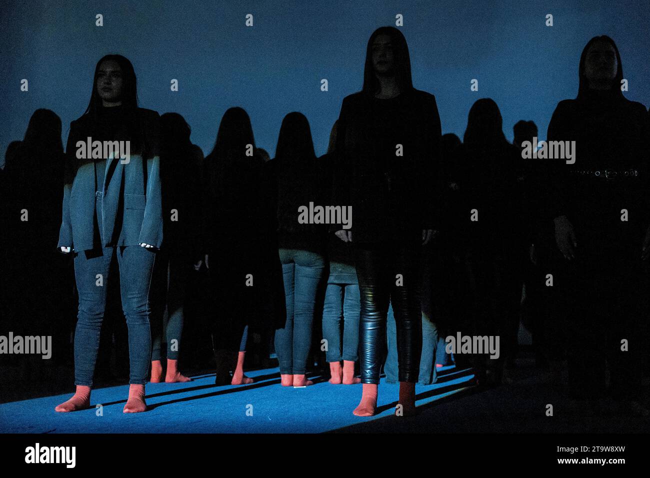 Young people play victims of violence in a performance dedicated to ...