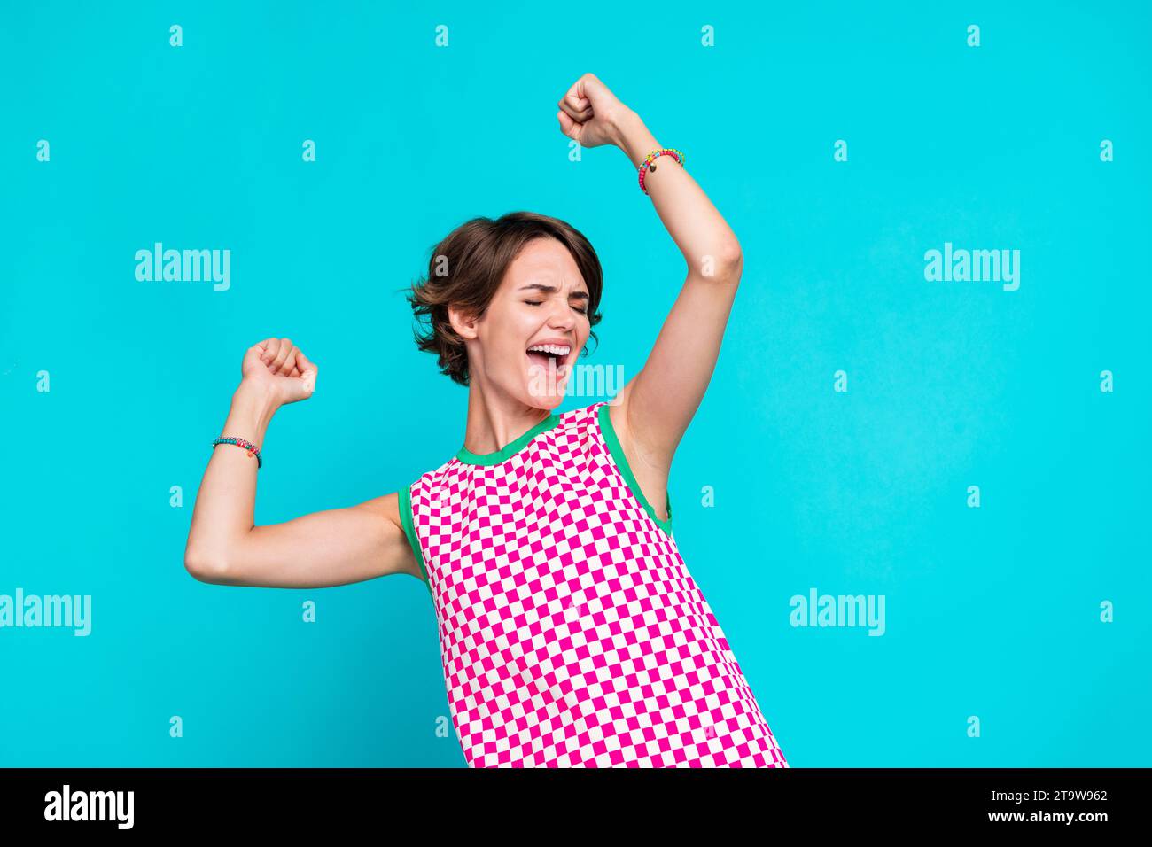 Photo of cheerful crazy girl wear stylish outfit raise hands shout yeah ...