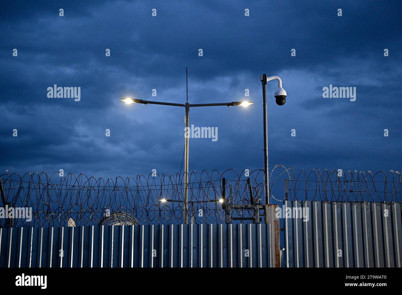 Roszke, Hungary. 27th Nov, 2023. A barbed wire fence stands on the ...