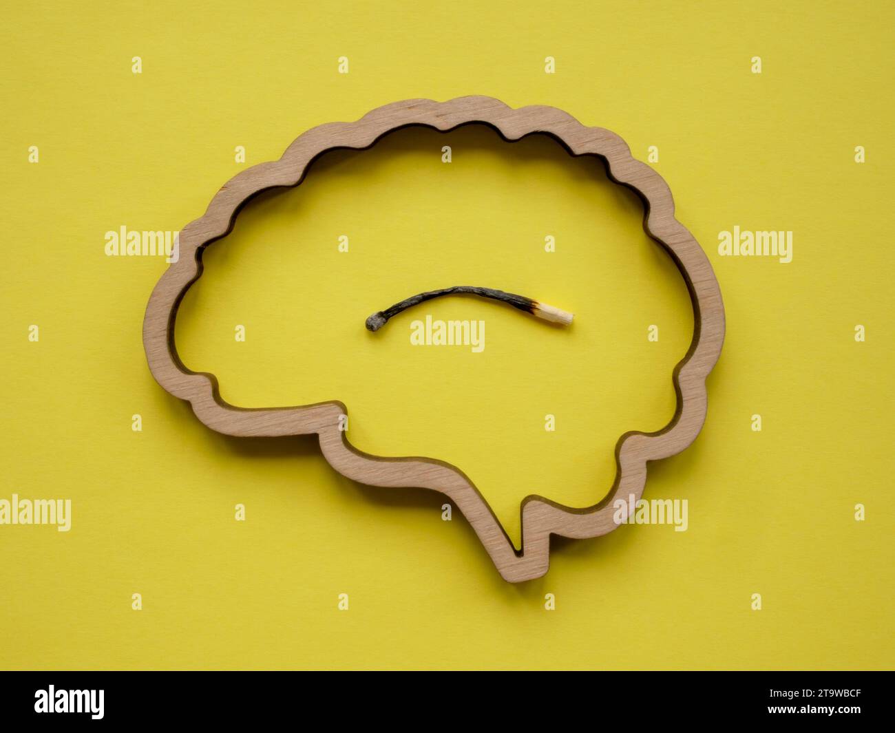 Burnout at work concept. Brain outline and burnt match Stock Photo - Alamy