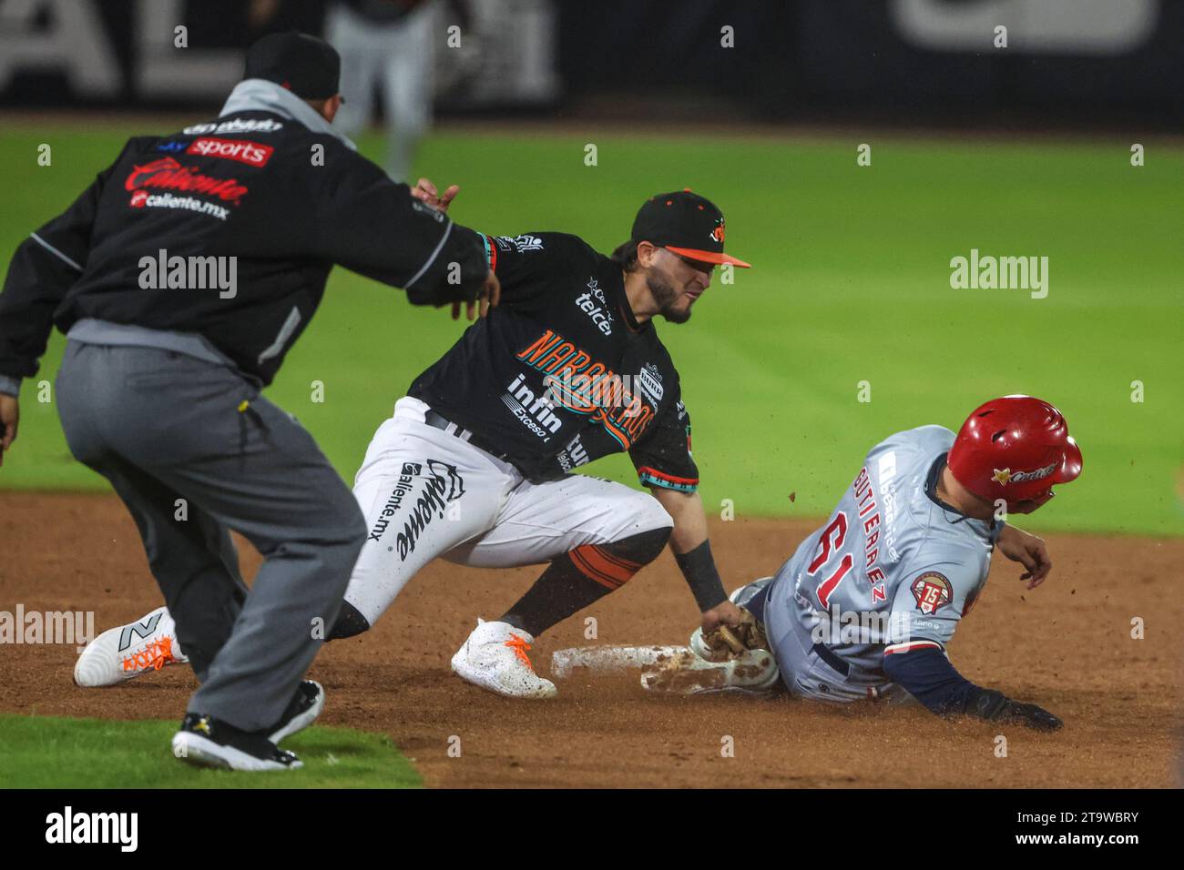 HERMOSILLO, MEXICO - NOVEMBER 24: Moises Gutierrez of Aguilas is thrown ...