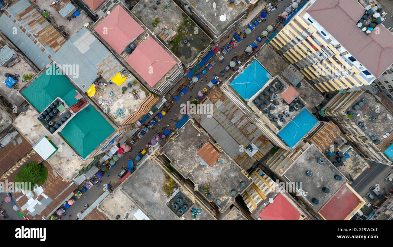 Aerial view of a cluster of modern city buildings surrounded by trees ...